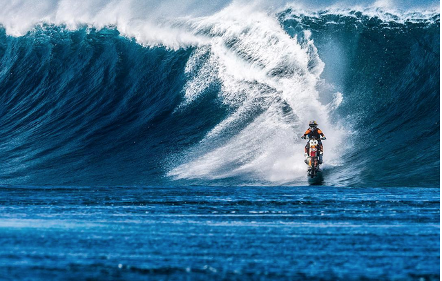 Man Rides Dirt Bike On A Wave Like He's Surfing