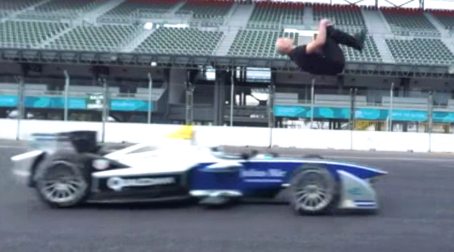 Watch This Stuntman Do A Blind Backflip Over A Speeding Race Car