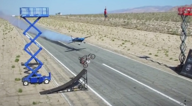 A Motorcycle Jumping A Plane Is Made Crazier With A Tightrope Walker