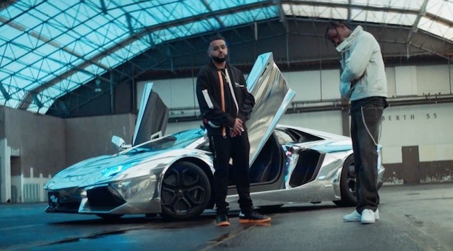 Travi$ Scott Pulls Up In A Lambo For The 'Biebs In The Trap' Video