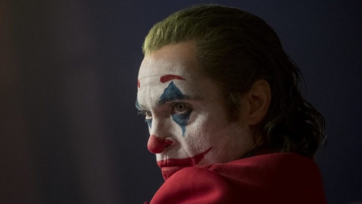 Joaquin Phoenix's 'Joker' Look Is Popping Up At Protests Everywhere