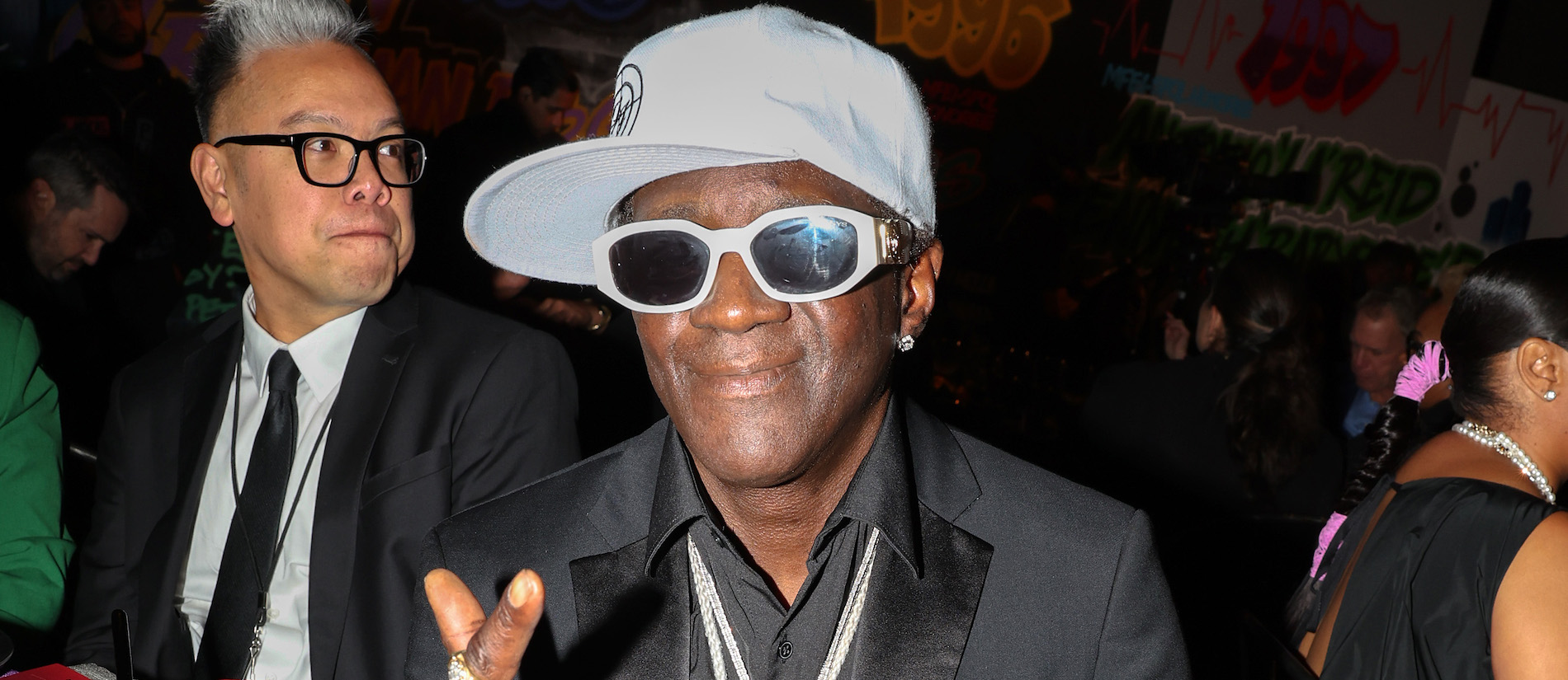 Flavor Flav Gifts Jordan Chiles With A Bronze Clock Necklace